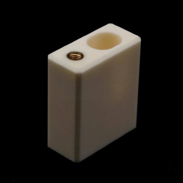 Aluminum oxide ceramic structural component with circular grooves and threaded holes inside the ...